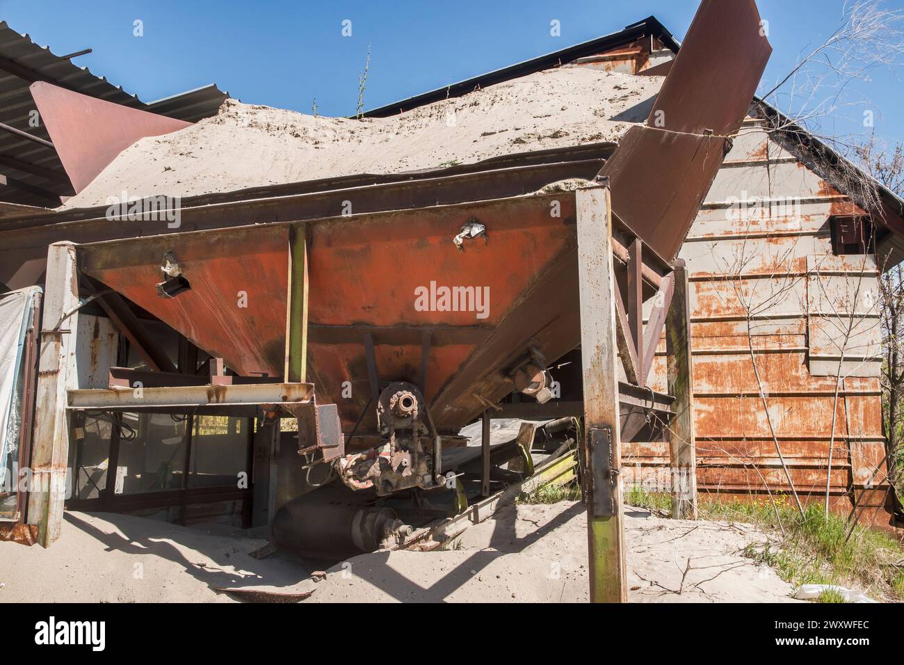 Old obsolete industrial facility for gravel pit sorting Stock Photo - Alamy