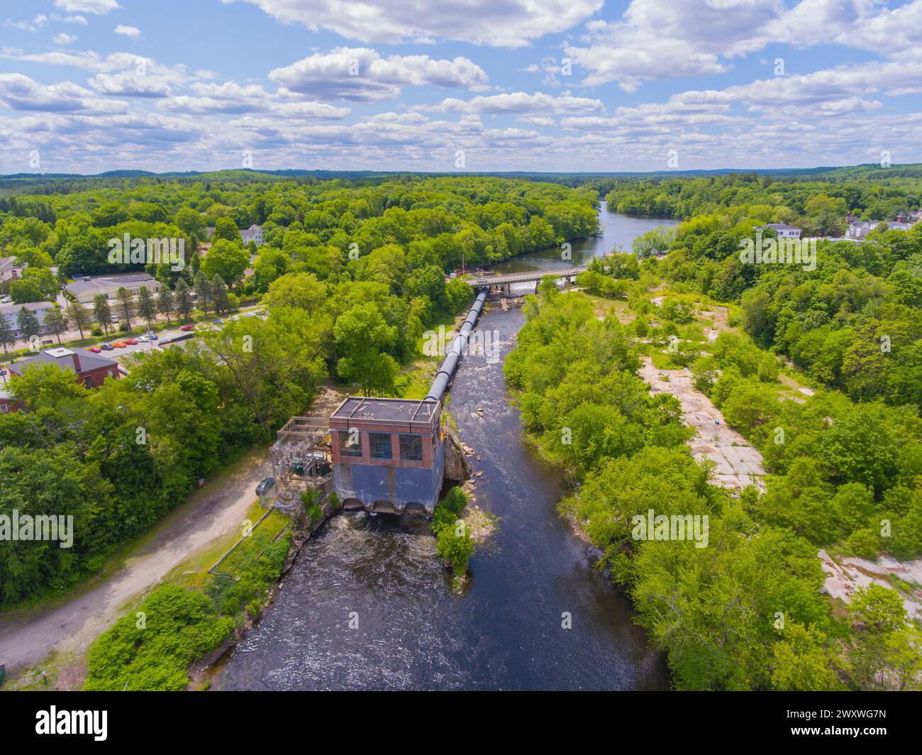 Nashua River and dam on the river at Pepperell historic town center aerial view in summer, town ...