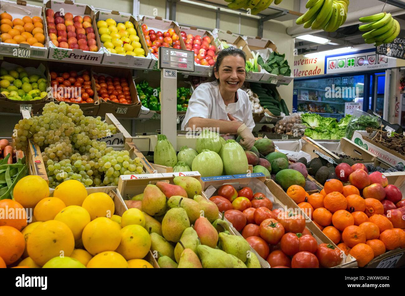 Shopkeeper and stall selling fruits and vegetables at the market in the ...