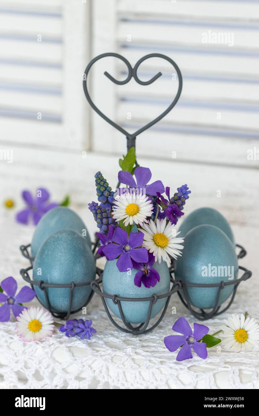 egg holder with blue coloured eggs decorated with periwinkle, daisy ...