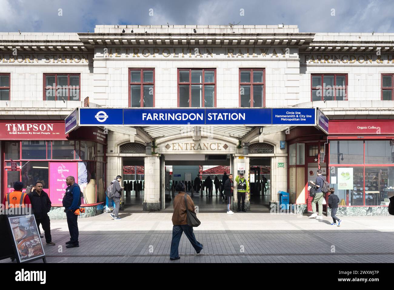 Pedestrians at Farringdon Station entrance, London. People using the ...