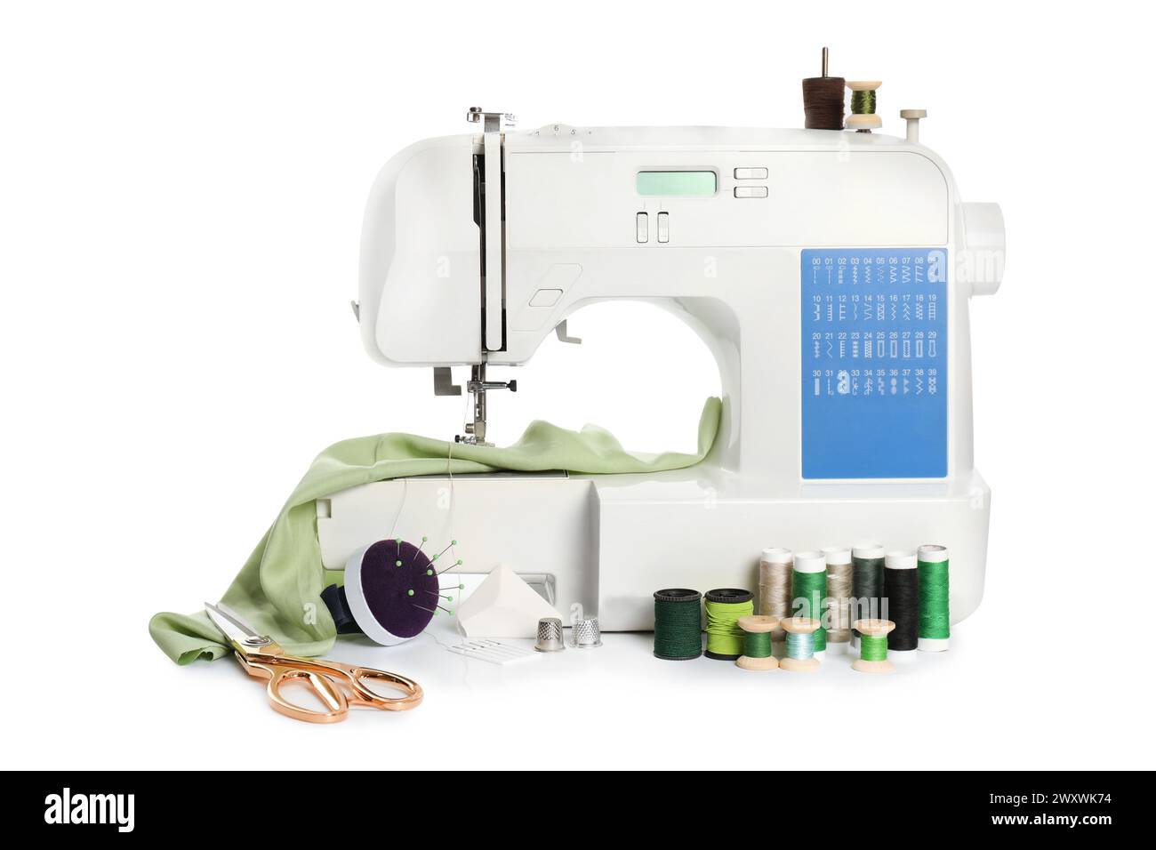 Modern sewing machine with light green cloth and craft accessories ...