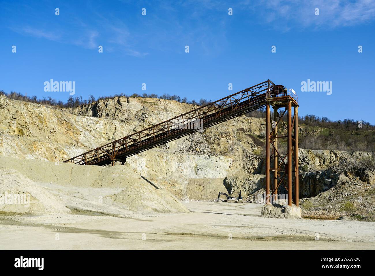 Huge rusty metal structures for transporting rocks in a dolomite mining ...