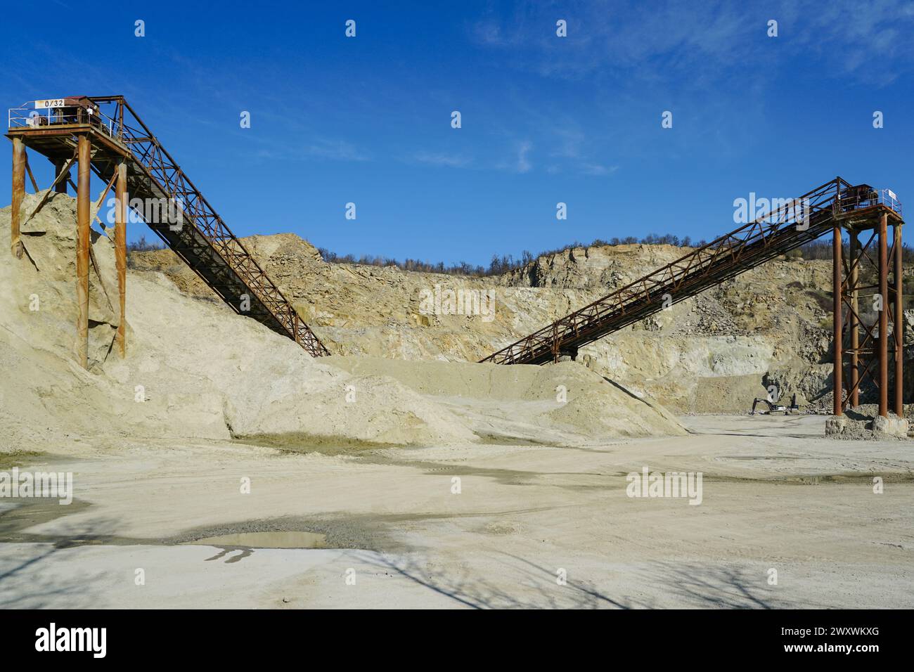 Huge rusty metal structures for transporting rocks in a dolomite mining ...