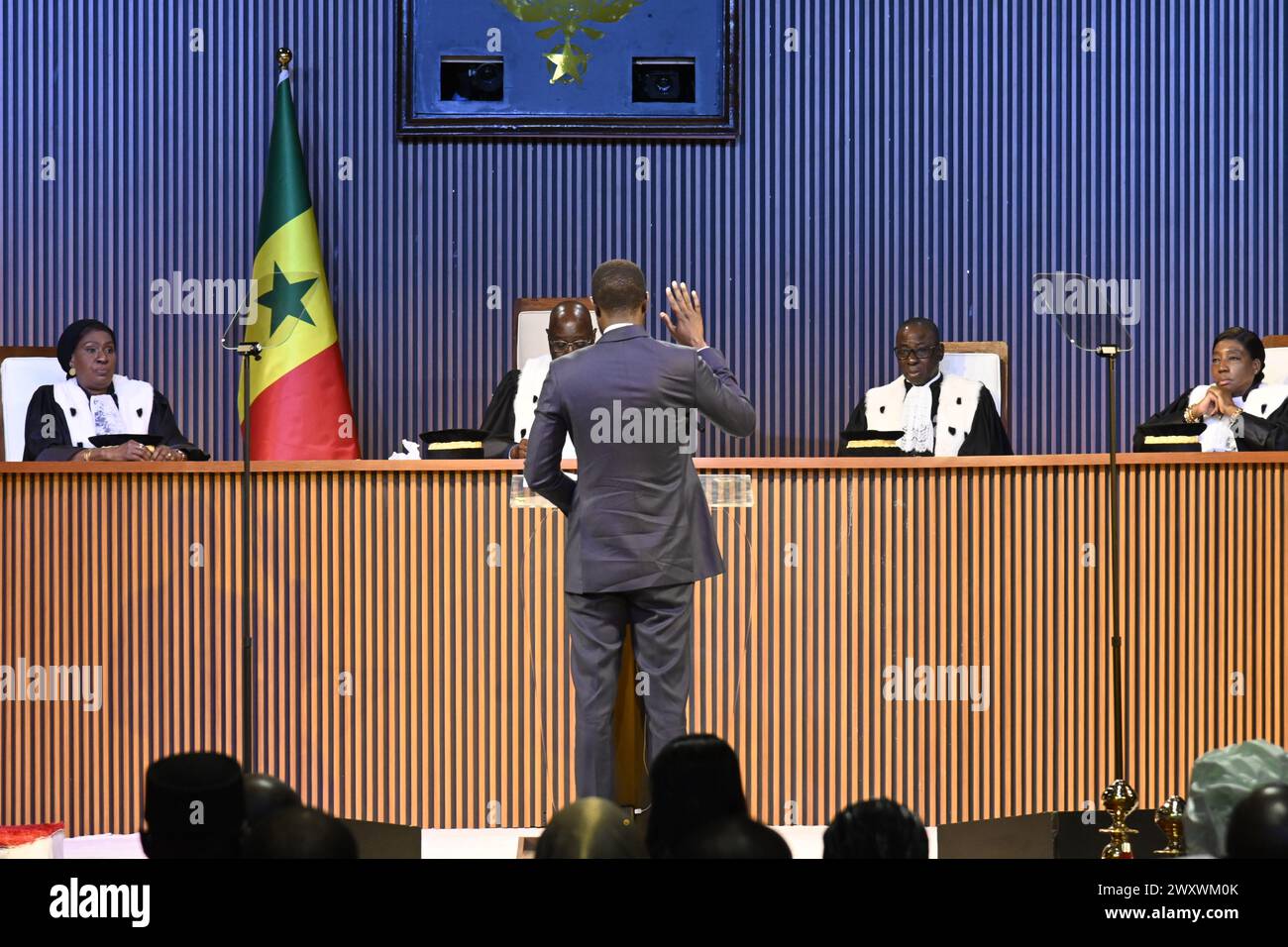 Diamniadio, Senegal. 2nd Apr, 2024. Bassirou Diomaye Faye (C) is sworn ...