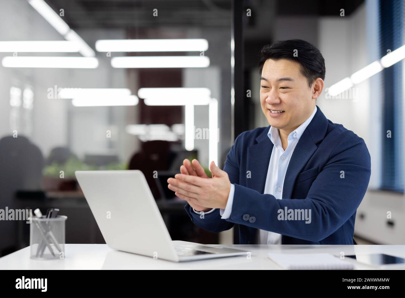 Professional businessman clapping hands while participating in an ...
