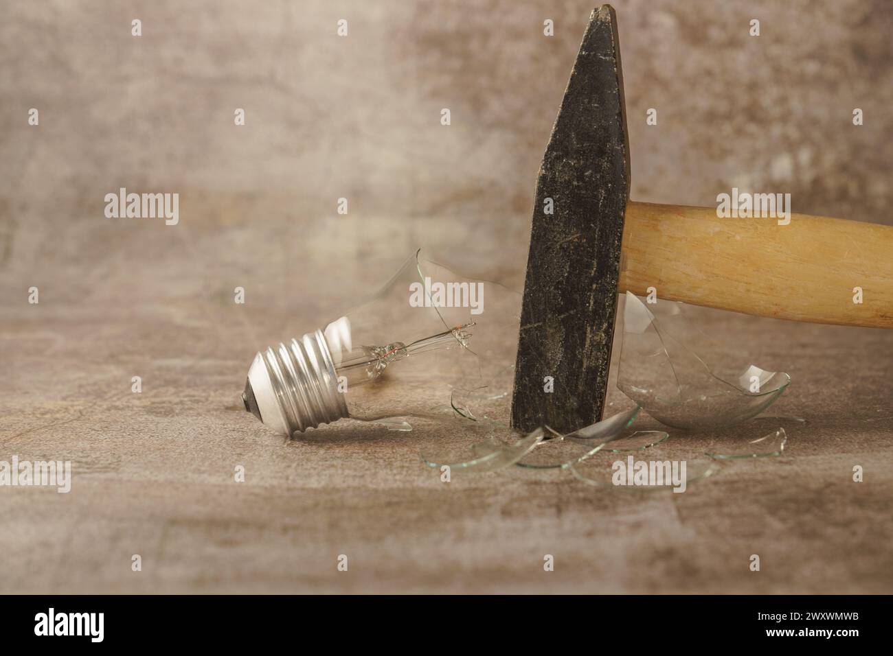 Broken light bulb hammer hi-res stock photography and images - Alamy