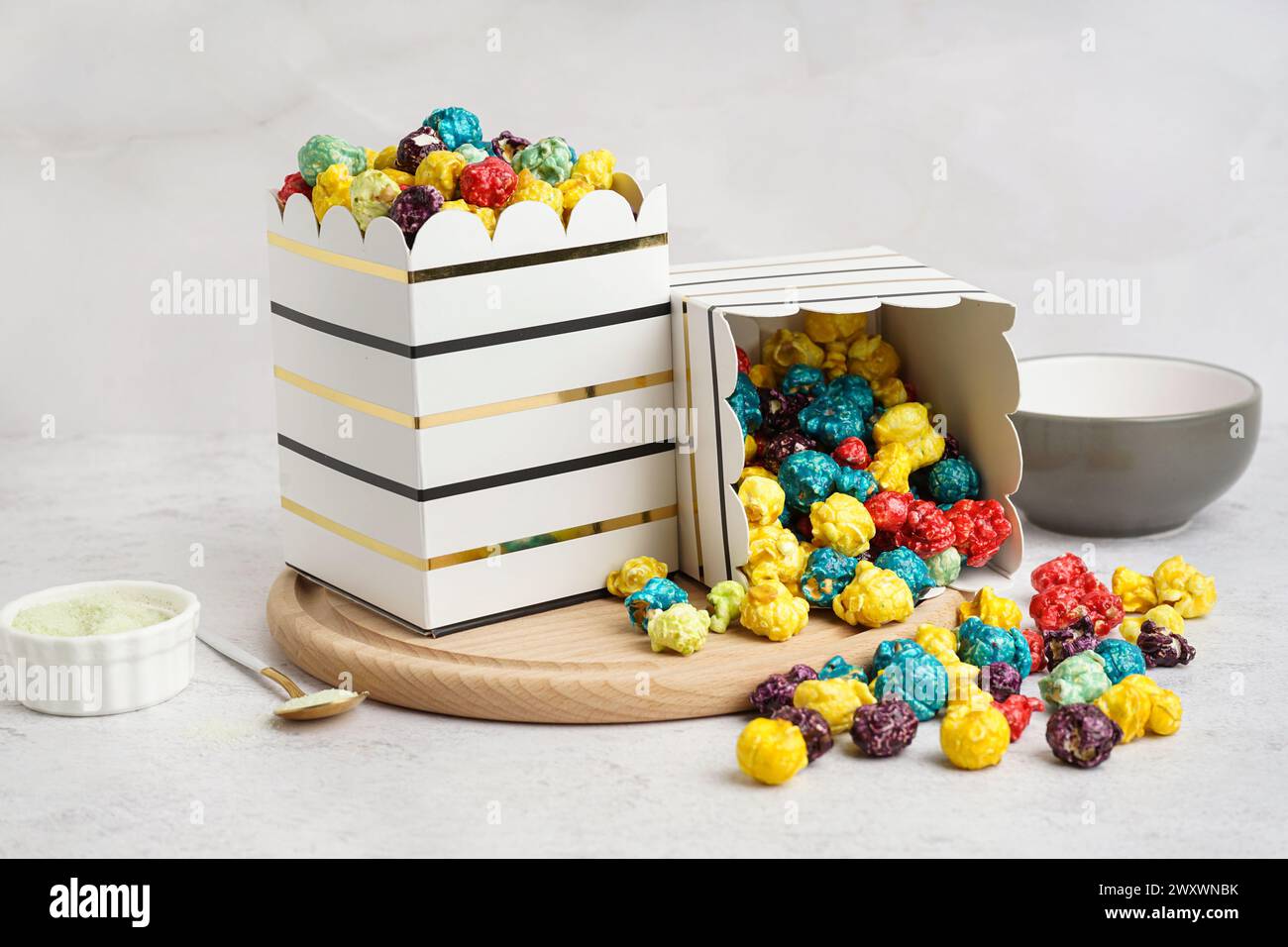 Buckets with sweet colorful popcorn on white background Stock Photo - Alamy