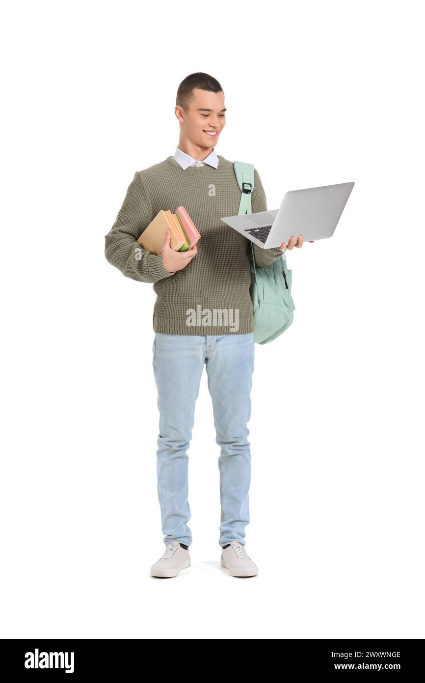 Male student with books and laptop on white background. End of school ...