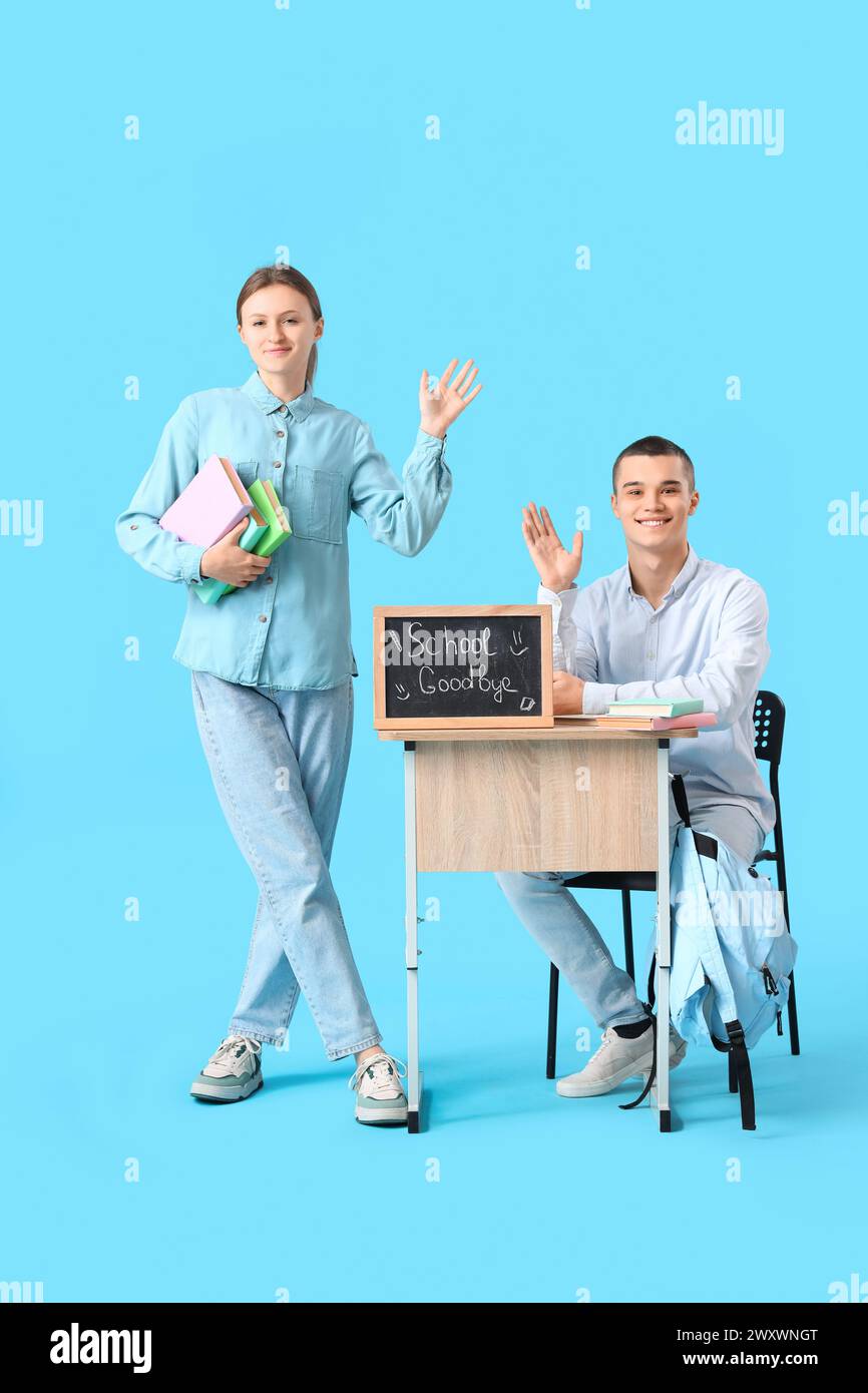 Students near chalkboard with text GOODBYE SCHOOL waving hand on blue ...