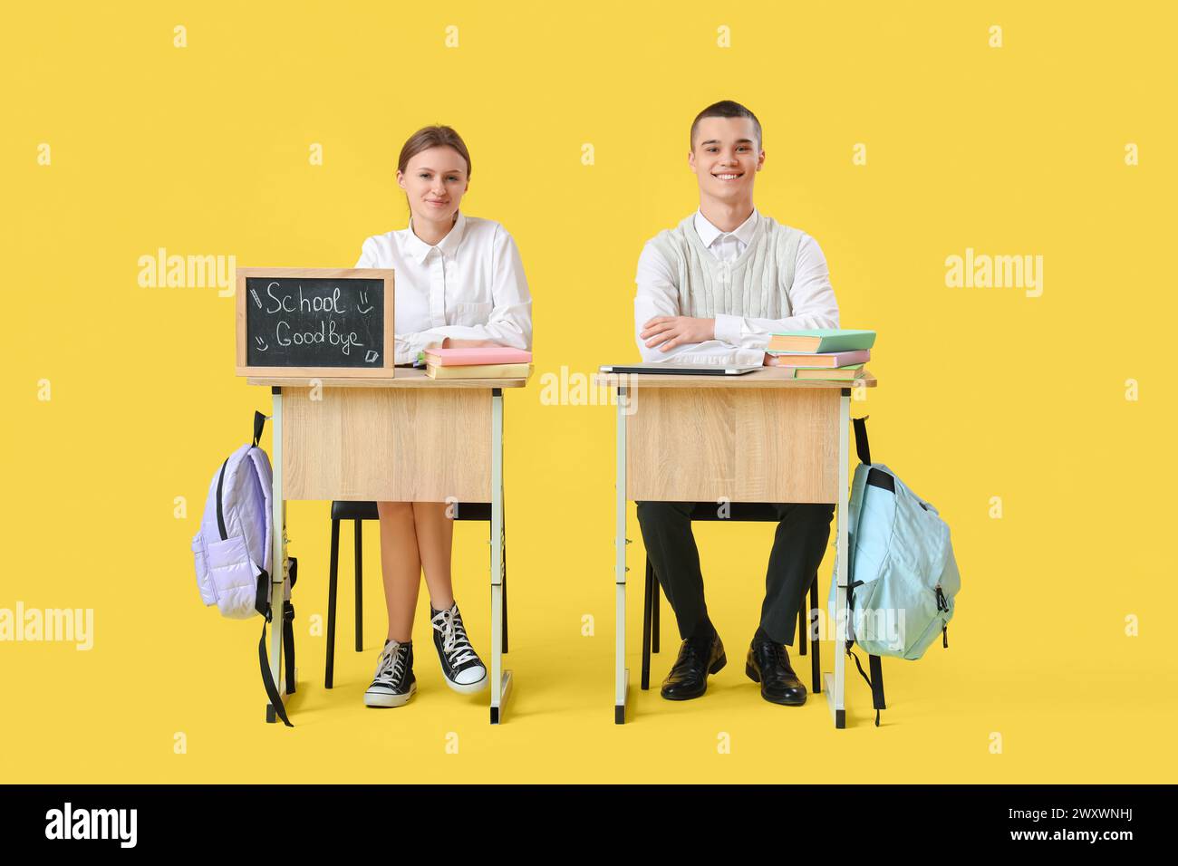 Students at school desks with chalkboard with text SCHOOL GOODBYE ...