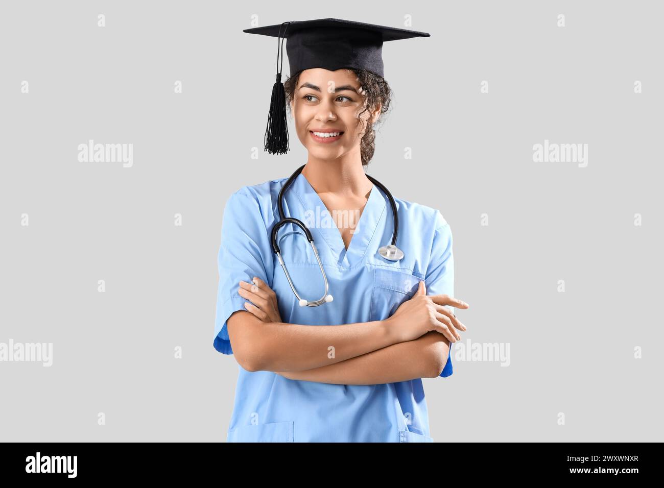 African-American female medical graduate student on white background ...