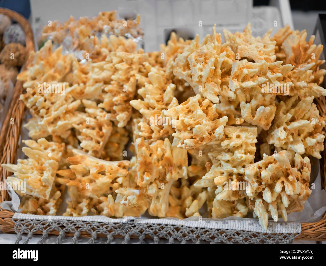 Traditional Lithuanian cake Sakotis or bankuchen is baked outside on a ...