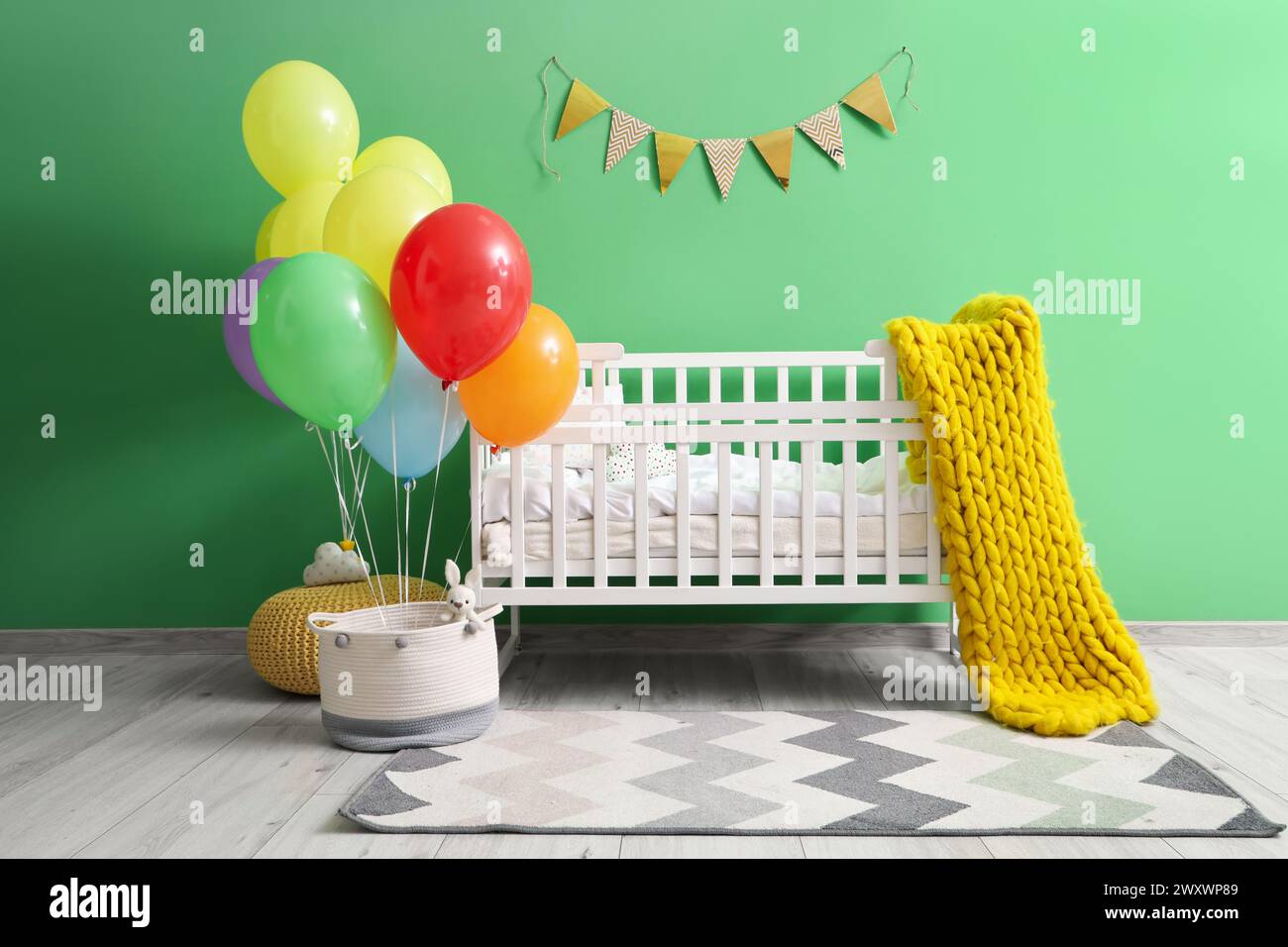 Interior of children's room with bunch of colorful balloons and crib ...