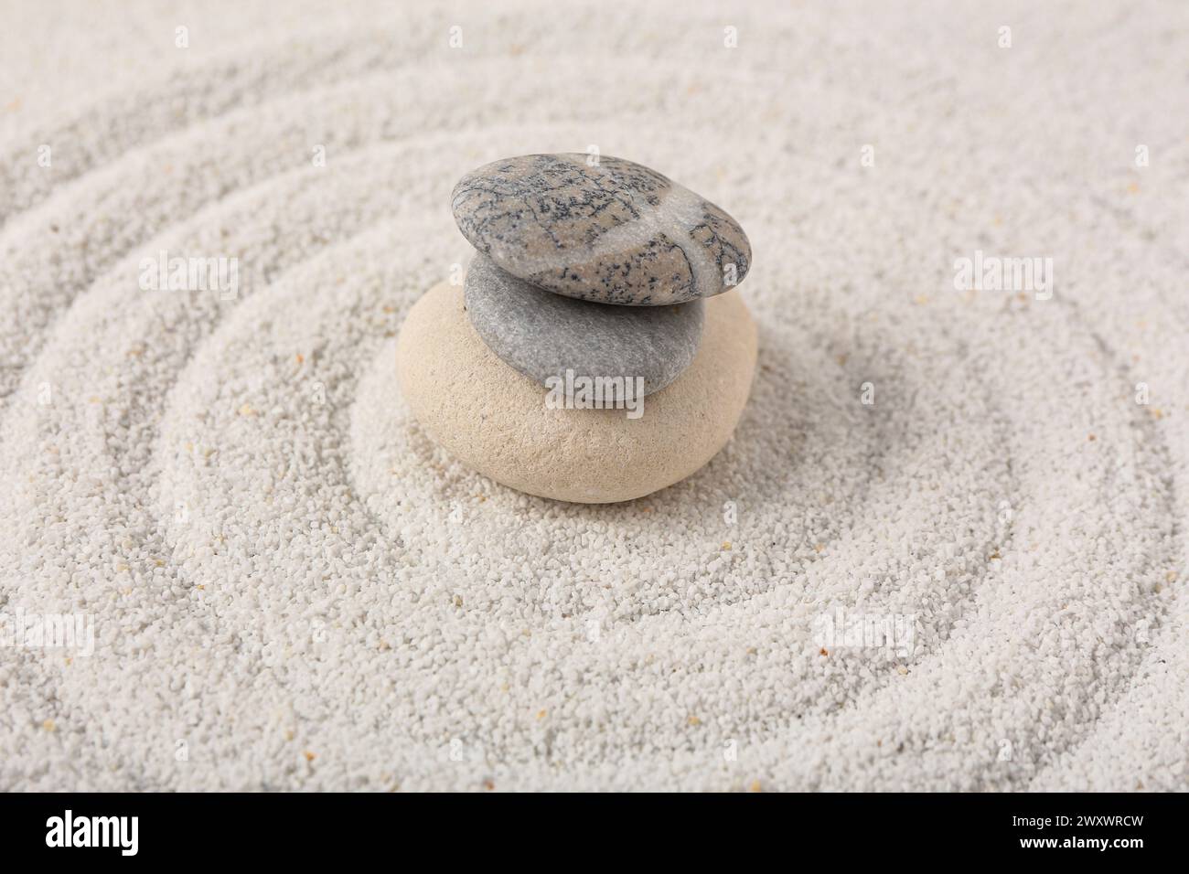Stack of stones on sand with lines in Japanese rock garden. Zen concept ...
