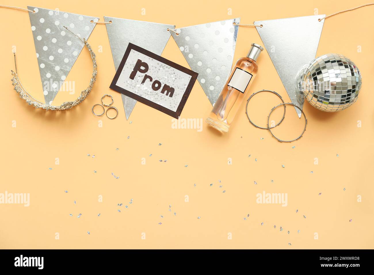 Word PROM with tiara, disco ball and perfume bottle on beige background ...
