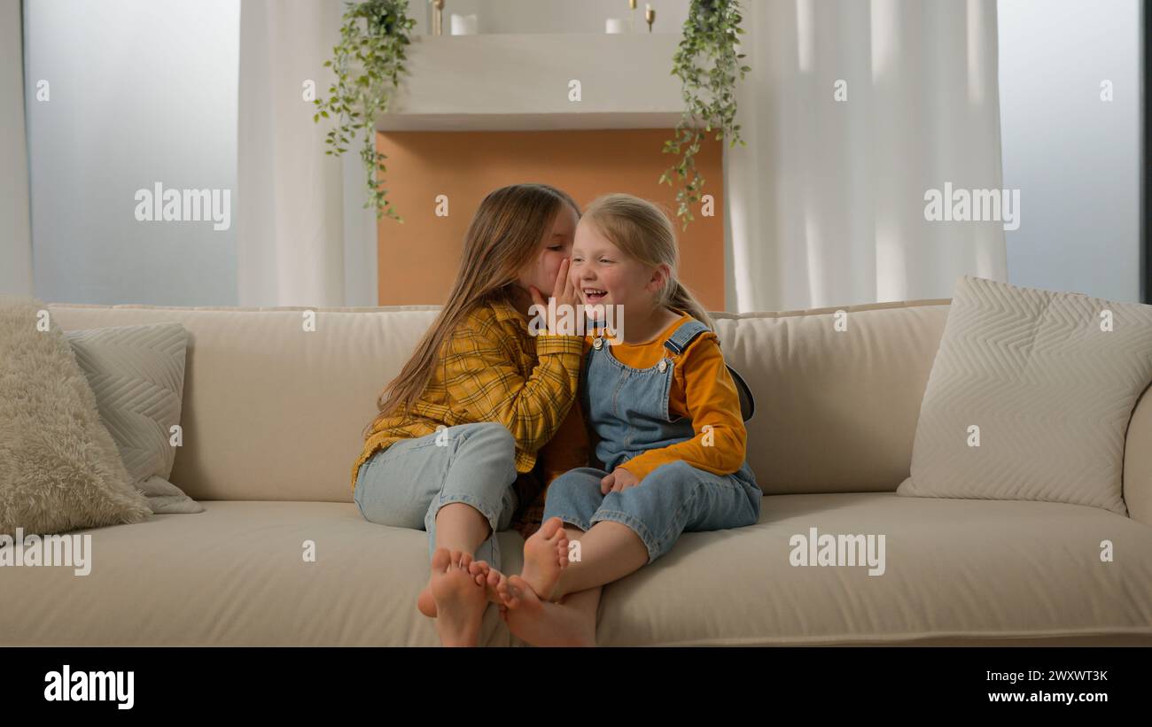 Little Caucasian girls kids children sisters friends daughters on couch ...