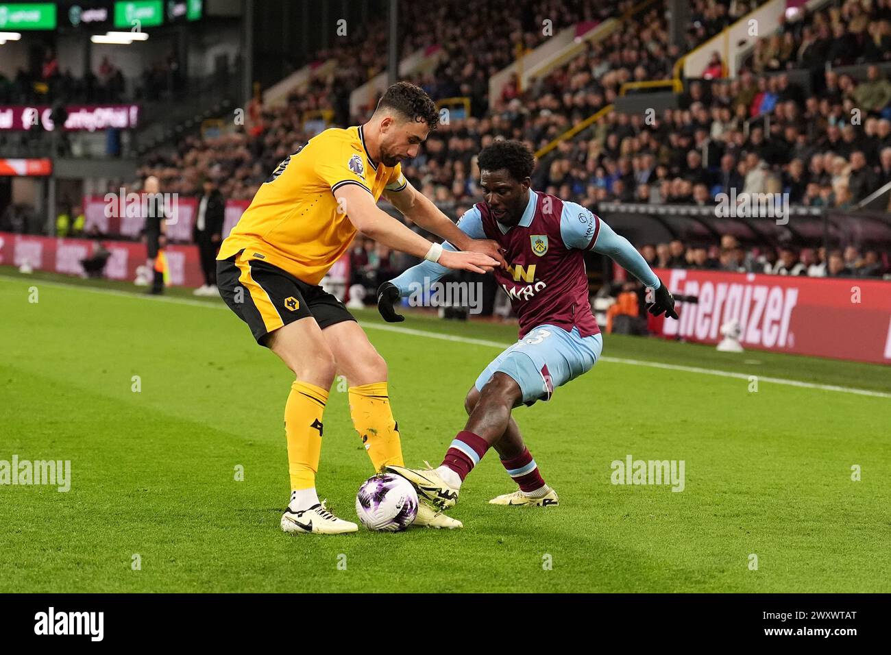 Wolverhampton Wanderers' Max Kilman (left) and Burnley’s David Datro ...