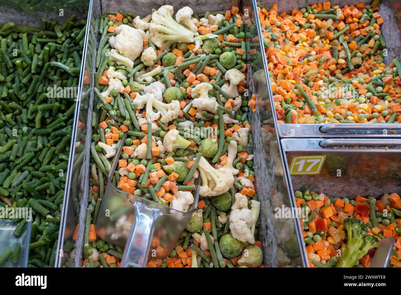 Frozen vegetables. Selling frozen vegetables in the fridge of a grocery ...