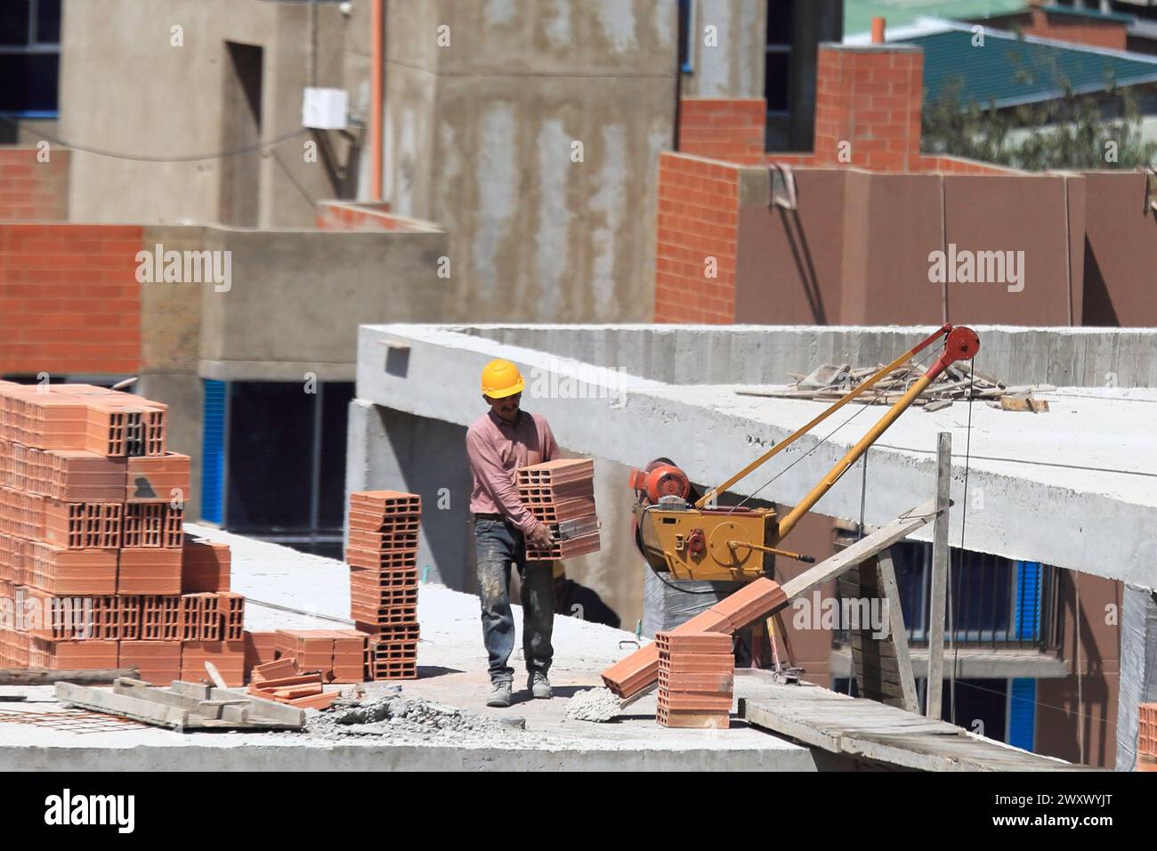 Bogota; Colombia. 26-01-2024- Construction workers meet during a ...