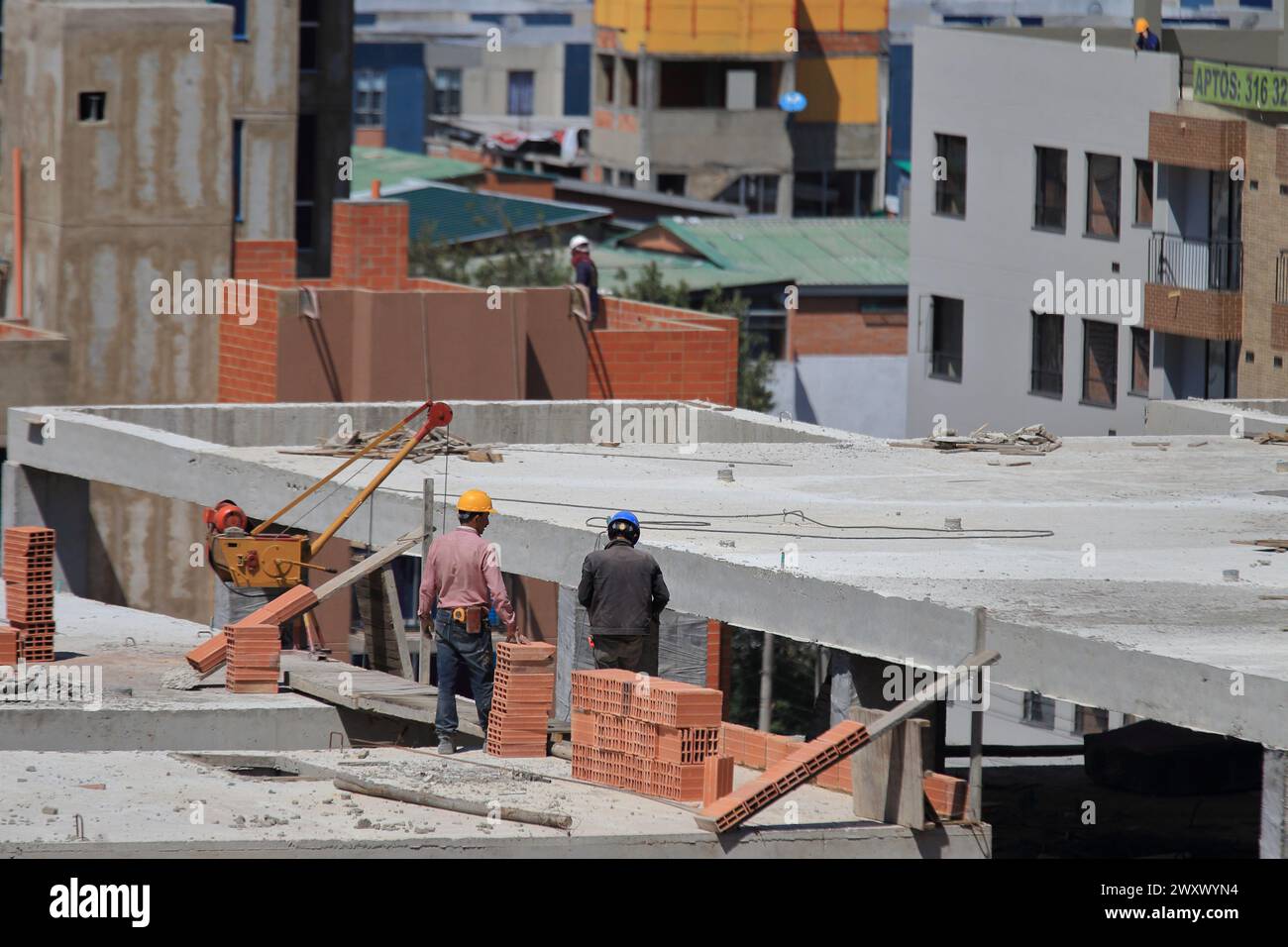 Bogota; Colombia. 26-01-2024- Construction workers meet during a ...