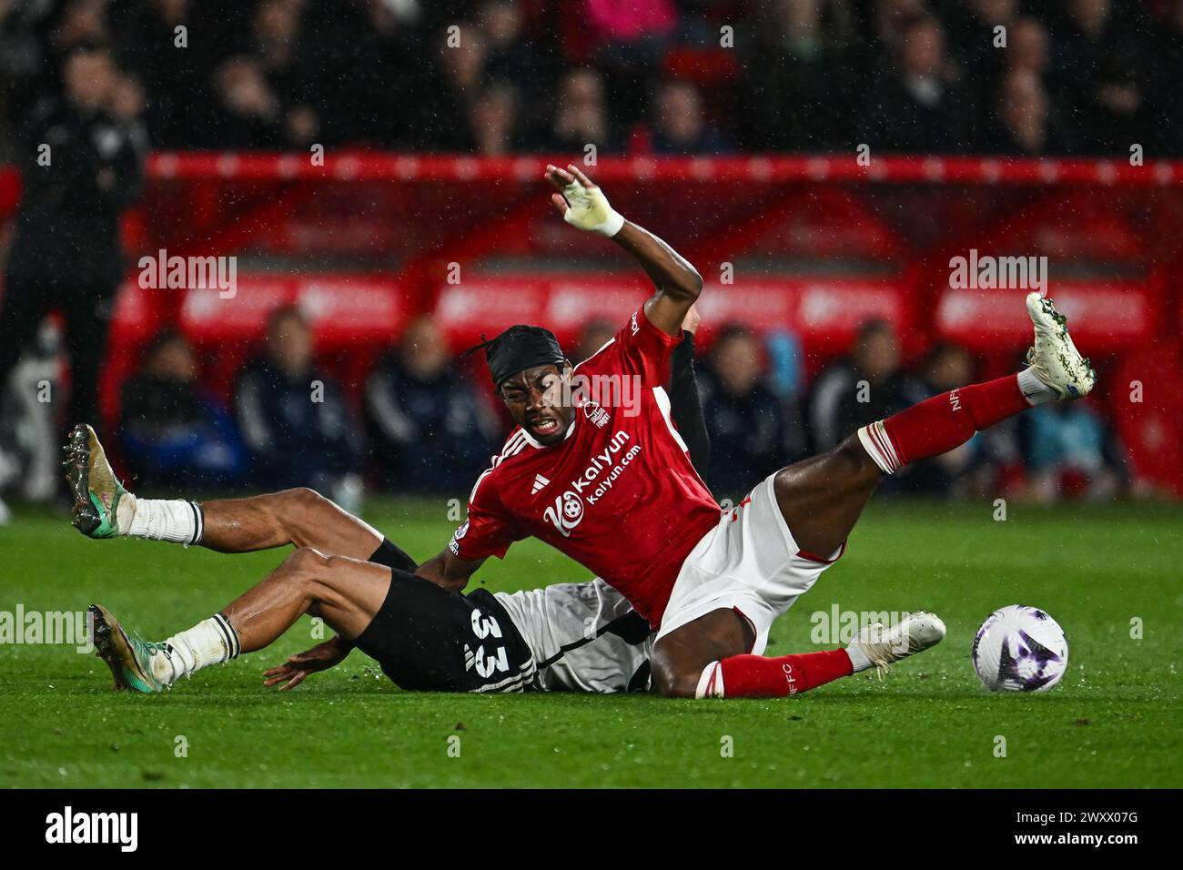 Anthony Elanga of Nottingham Forest is tackled by Antonee Robinson of ...