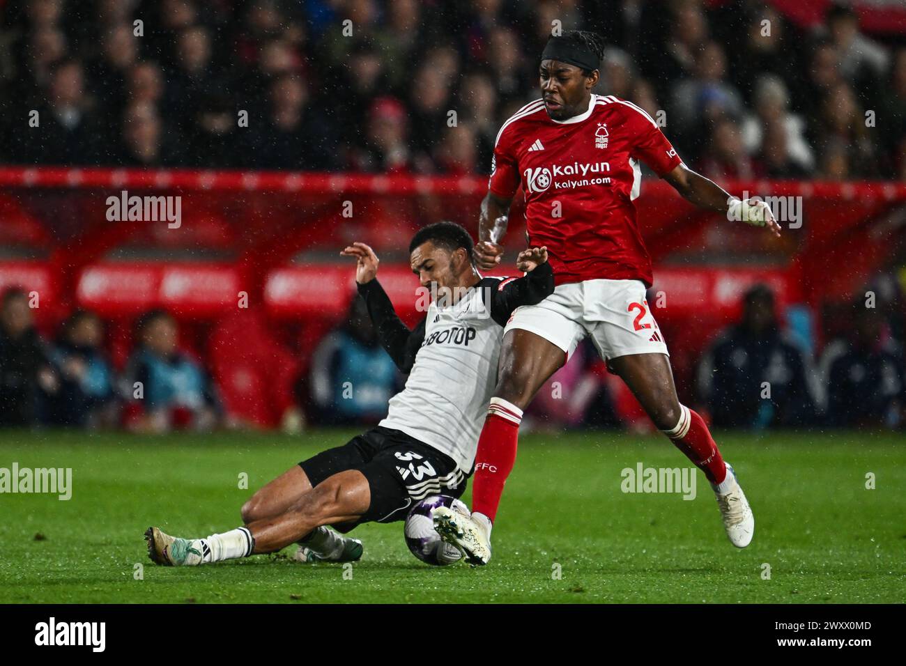 Anthony Elanga of Nottingham Forest is tackled by Antonee Robinson of ...