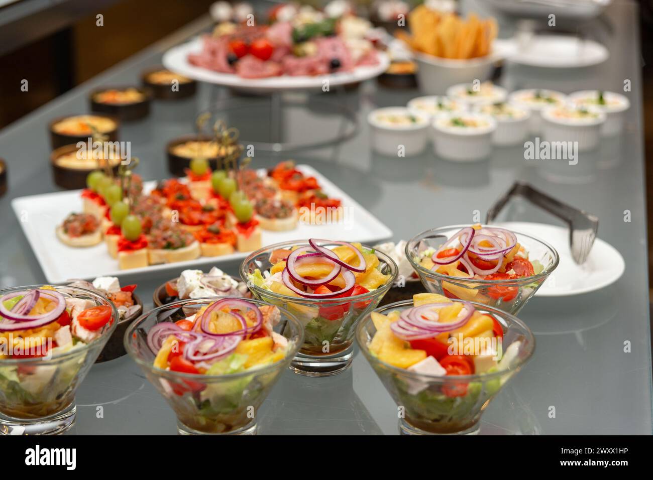 Buffet table with cold appetizers and salads. Buffet food, catering ...