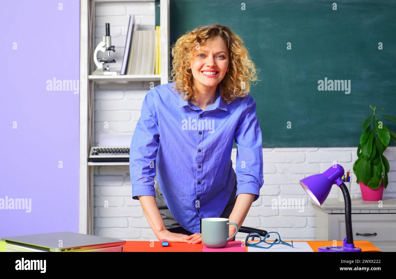 Portrait Of Confident Female Teacher In Classroom Smiling Teacher In