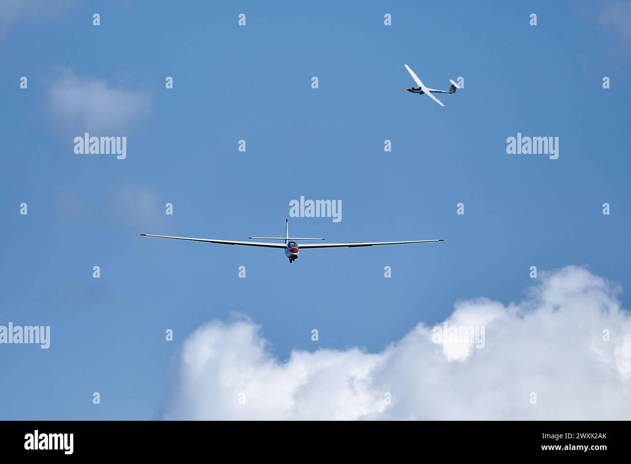 Glider in the sky begin landing Stock Photo - Alamy