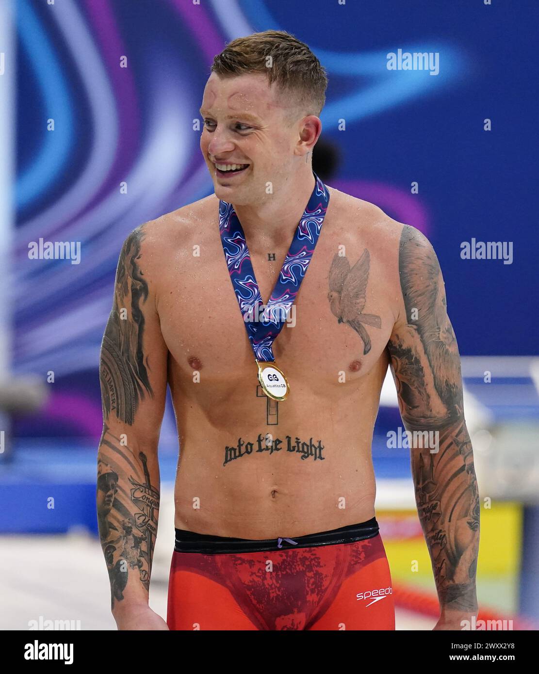 Adam Peaty reacts after winning the Men's 100 Breaststroke Final during ...
