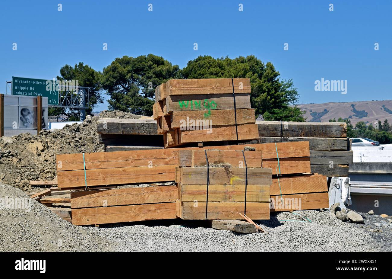 stack of wood beams next to the 880 freeway and Alameda Creek ...