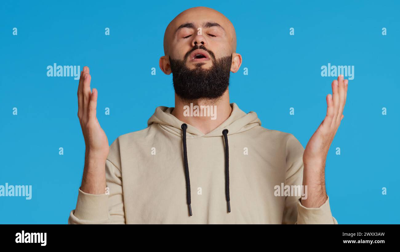 Muslim person presenting his belief in Allah by praying on camera ...