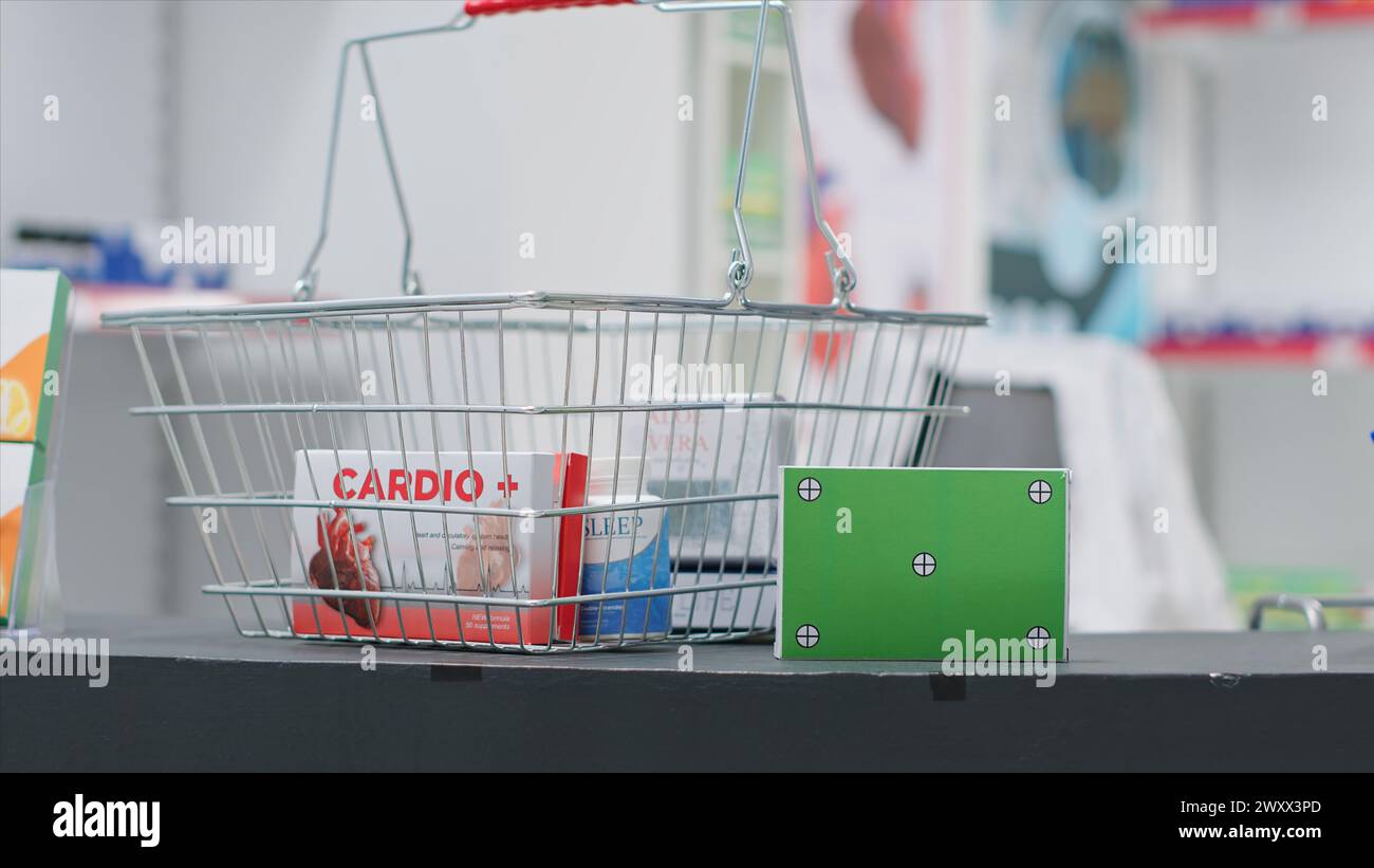 Basket filled with medicaments and a box with greenscreen layout at ...