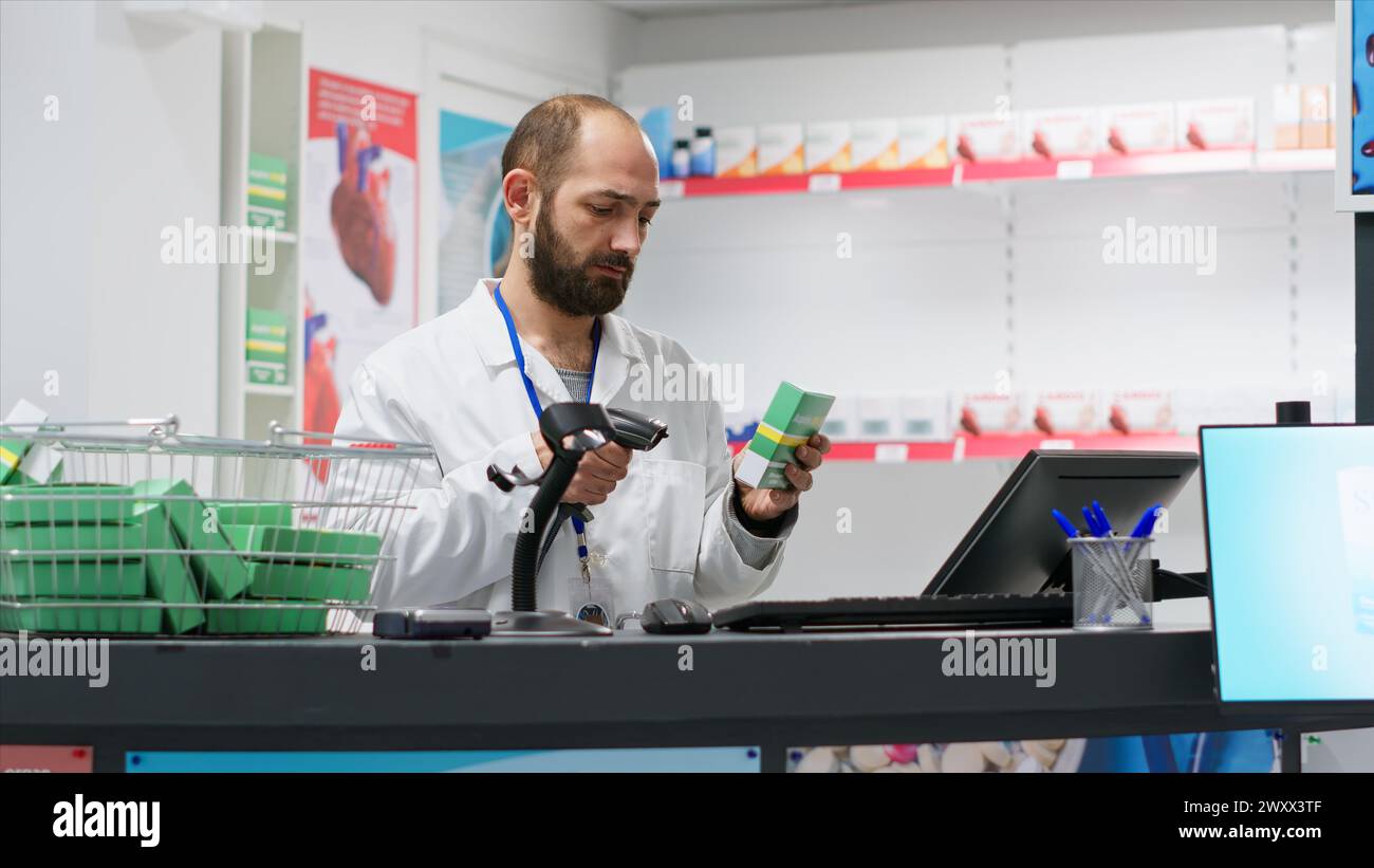 Medical retail clerk scanning supplies to register new stock, working ...