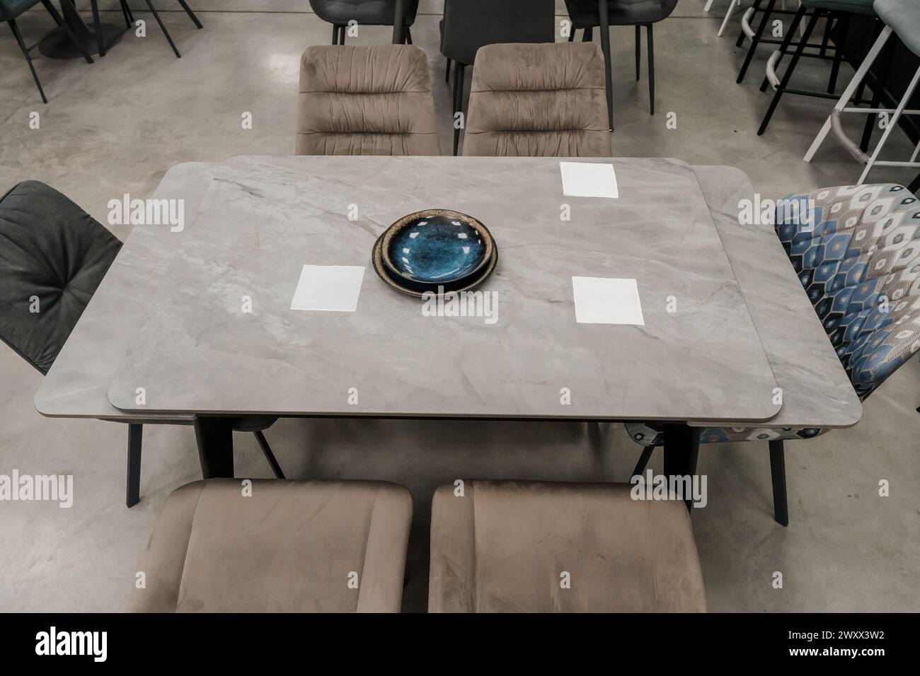 Gray wooden table combined with beige wooden chairs with soft fabric ...