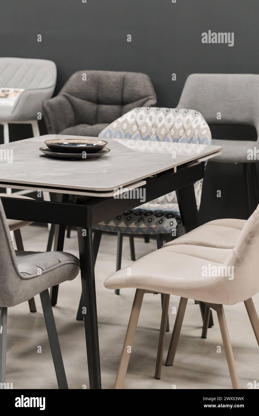 Gray wooden table combined with beige wooden chairs with soft fabric ...