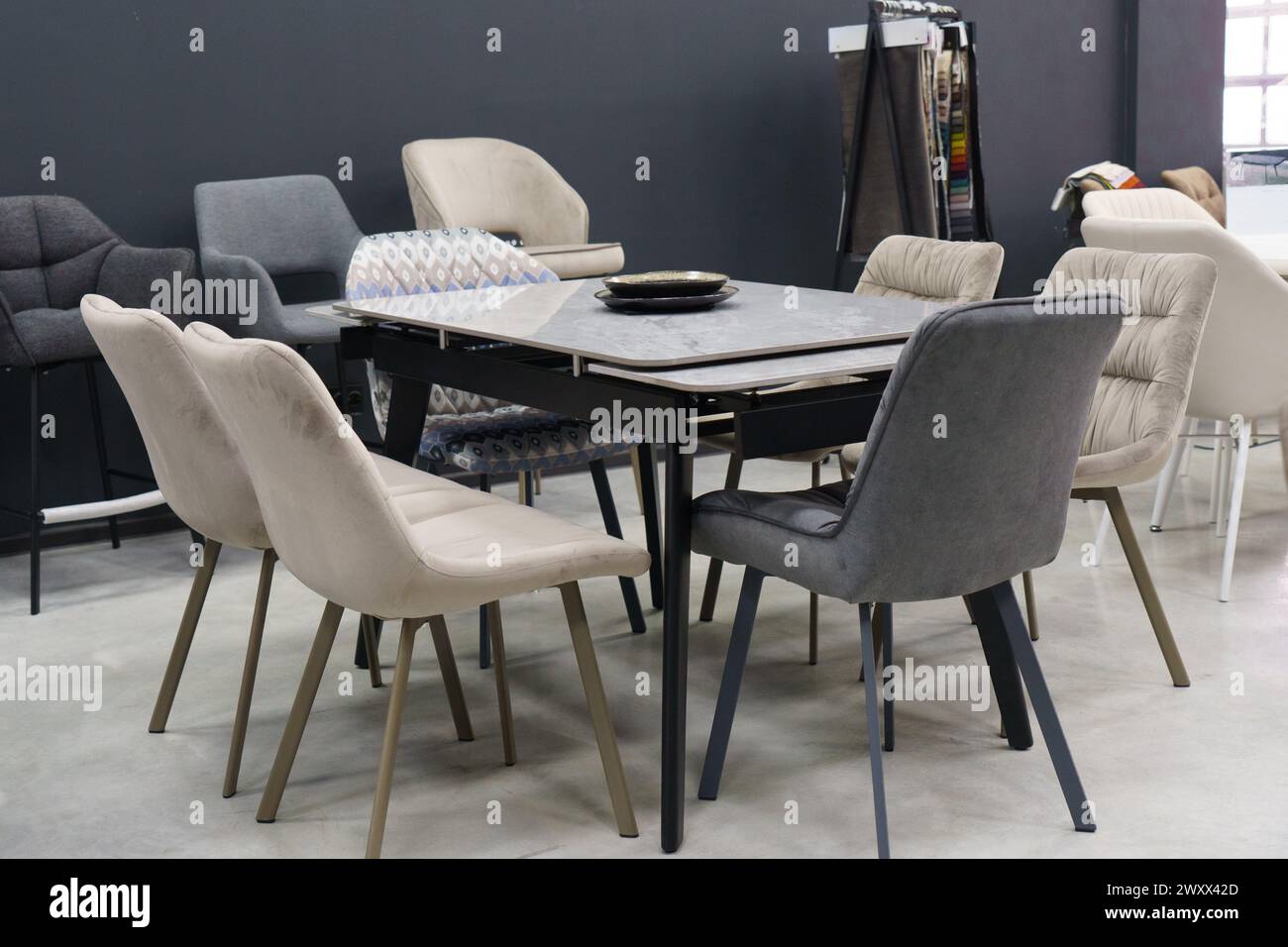 Gray wooden table combined with beige wooden chairs with soft fabric ...