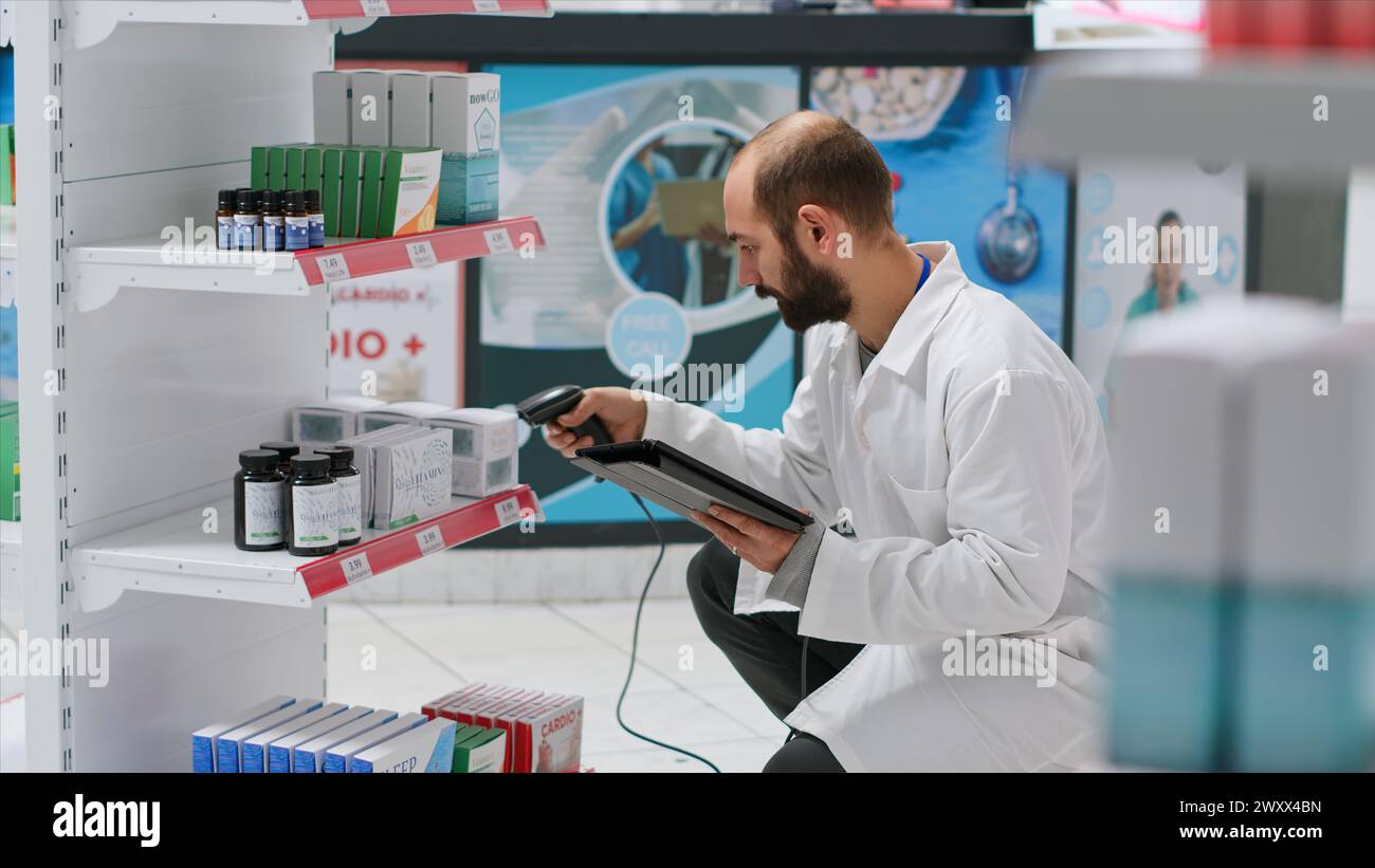 Pharmaceutical helper monitors the medication stock on shelves ...