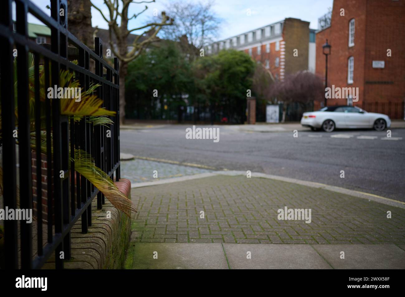 empty street during daytime in london with black metal railing with out ...
