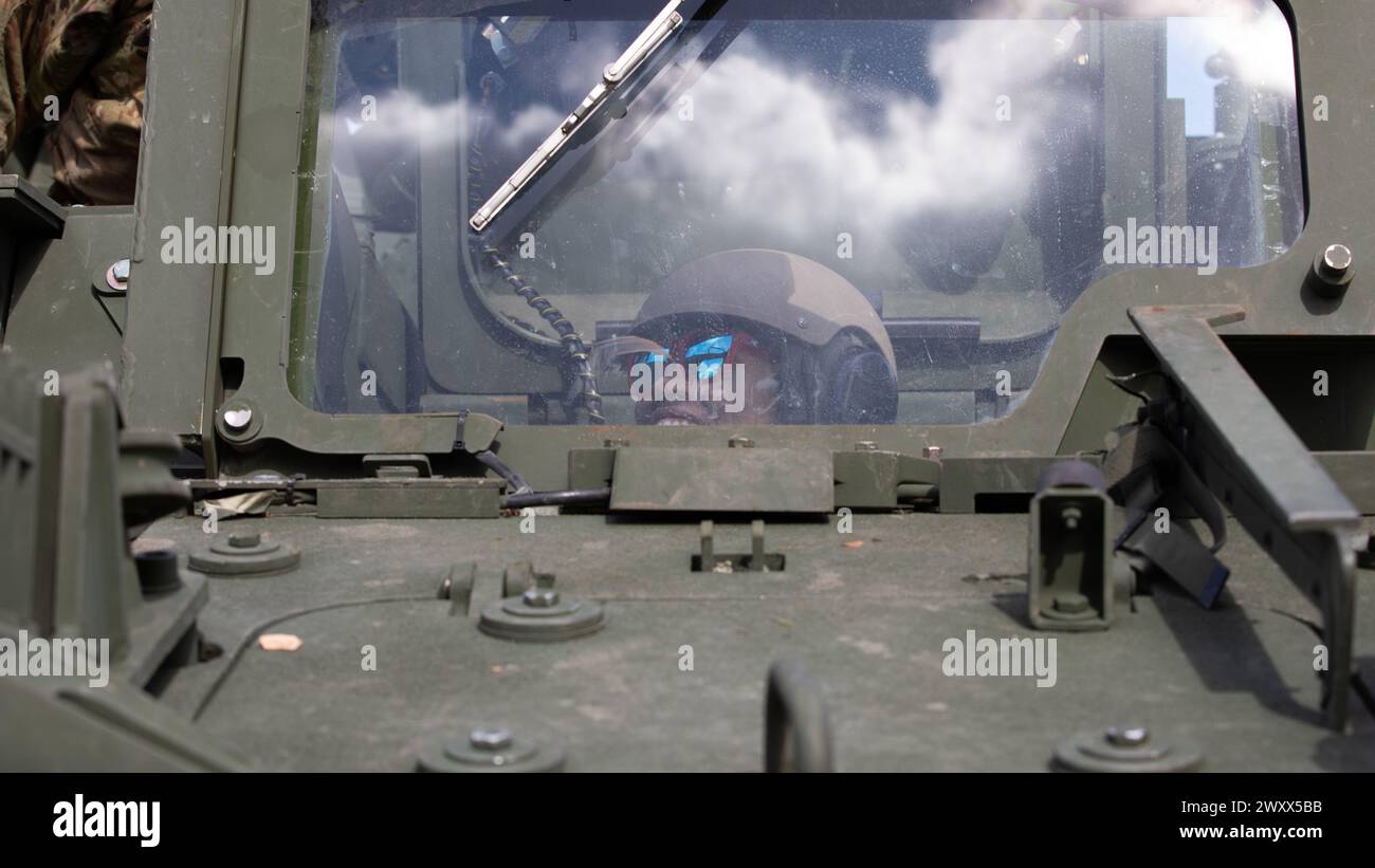 A U.S. Army spouse smiles inside an M1126 Stryker Combat Vehicle during ...