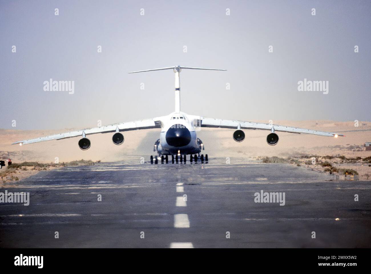 Front view of a C-5 Galaxy aircraft moving down the runway during ...