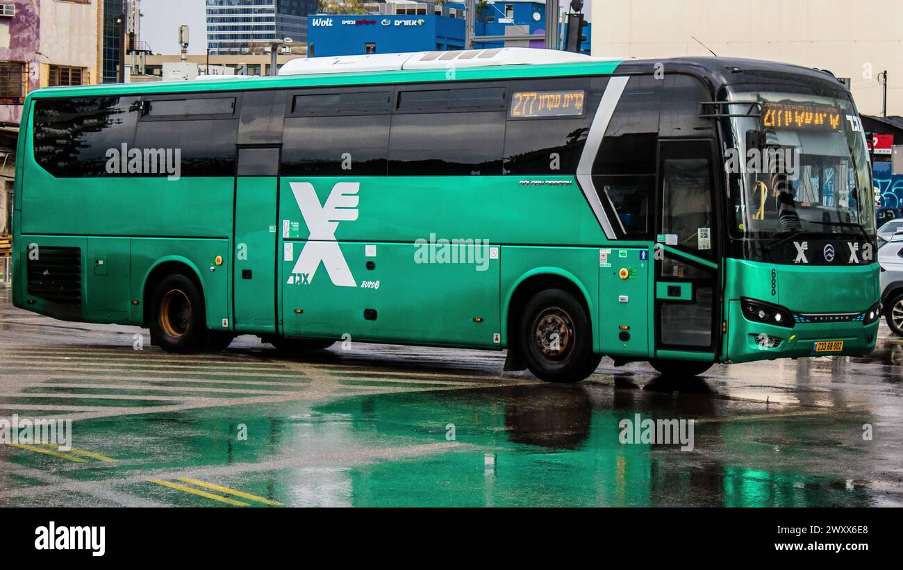 Tel Aviv, Israel, February 18, 2024 Local israeli bus under the rain ...