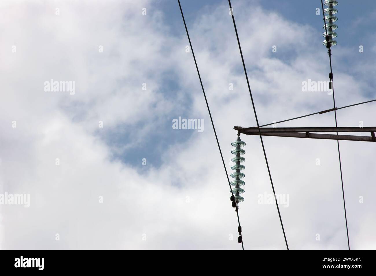 High voltage grid electric power line electricity pilon traverse glass ...