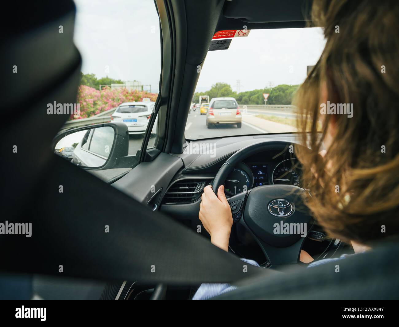 Mallorca, Spain - Jun 28, 2023: A woman behind the wheel of a Toyota ...