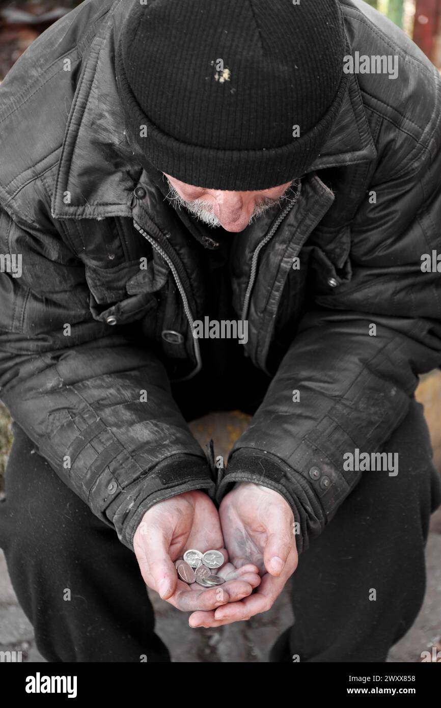Homeless man counting money hi-res stock photography and images - Alamy