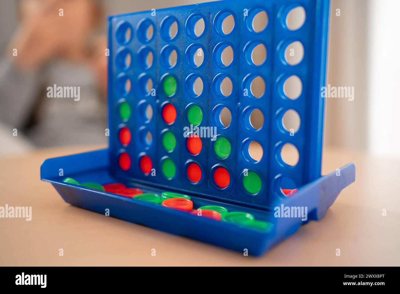 A close-up shot of a partially completed Connect Four game, showing an ...