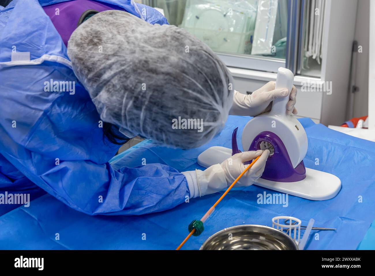 Disposable heart valve crimping tool. In the operating room, the doctor ...