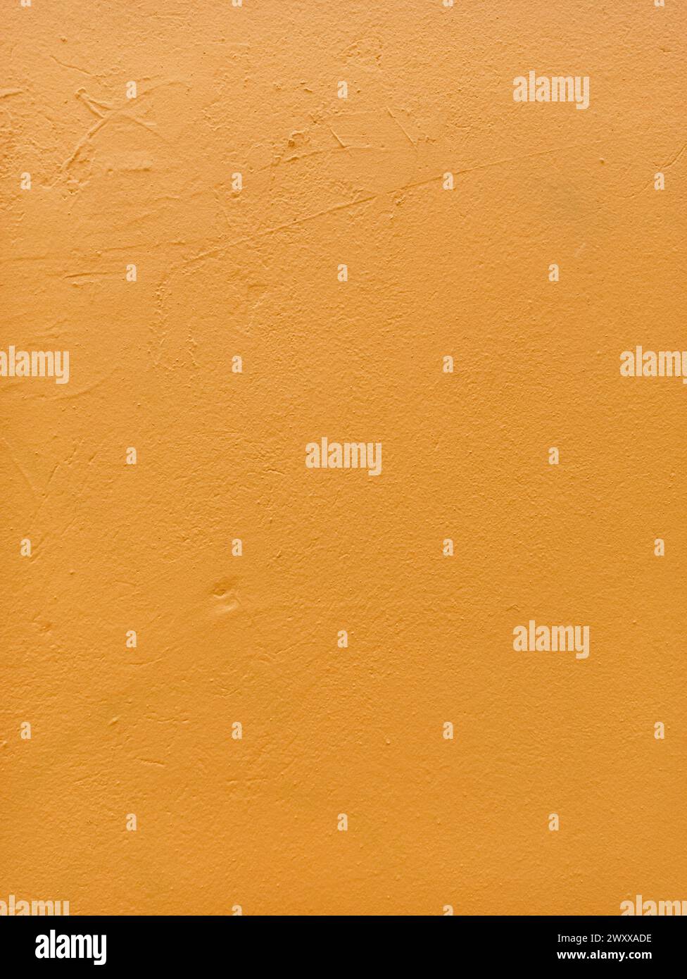 Blurred orange stucco wall background painted cement wall texture Stock Photo - Alamy