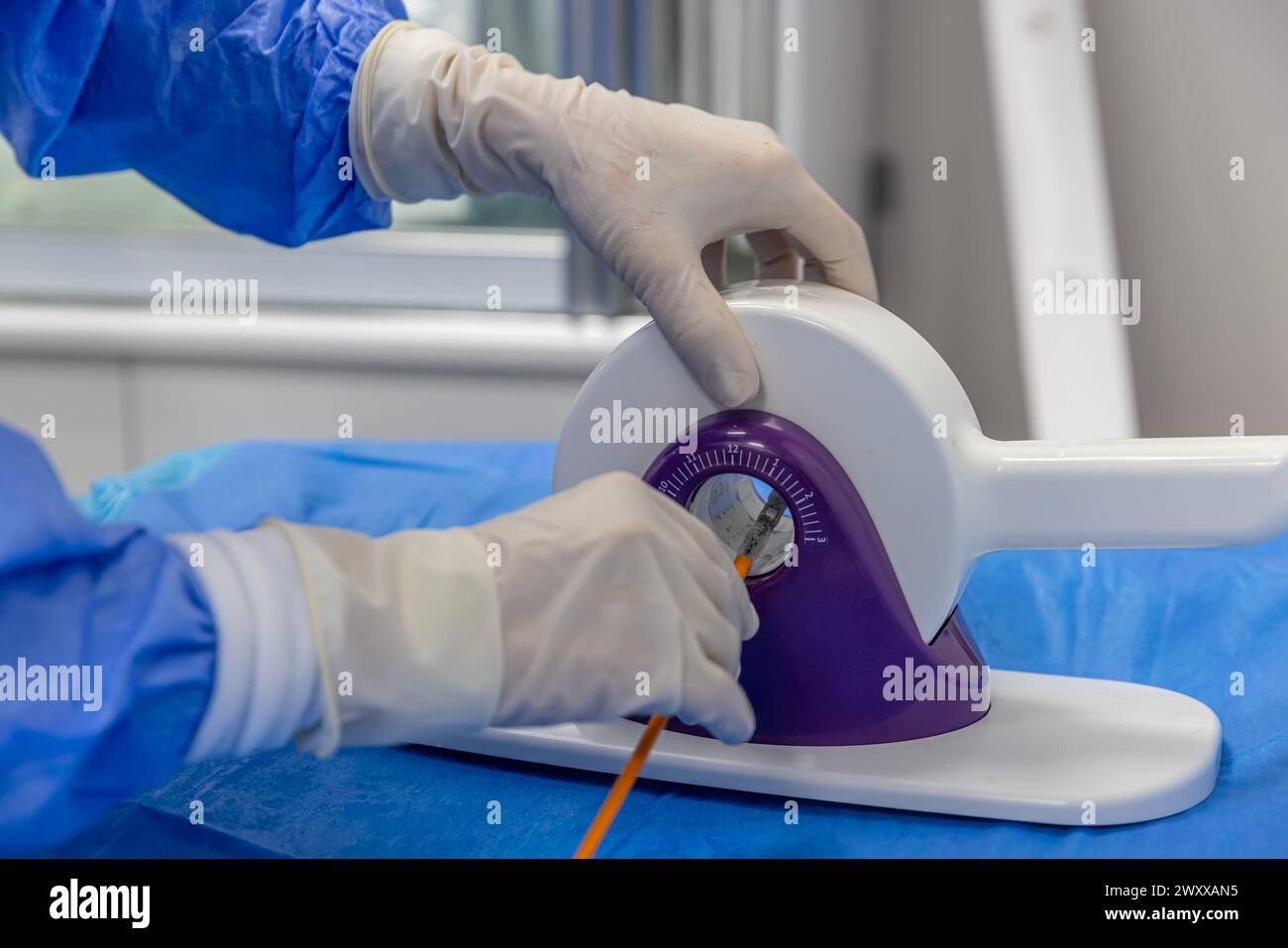 Disposable heart valve crimping tool. In the operating room, the doctor ...